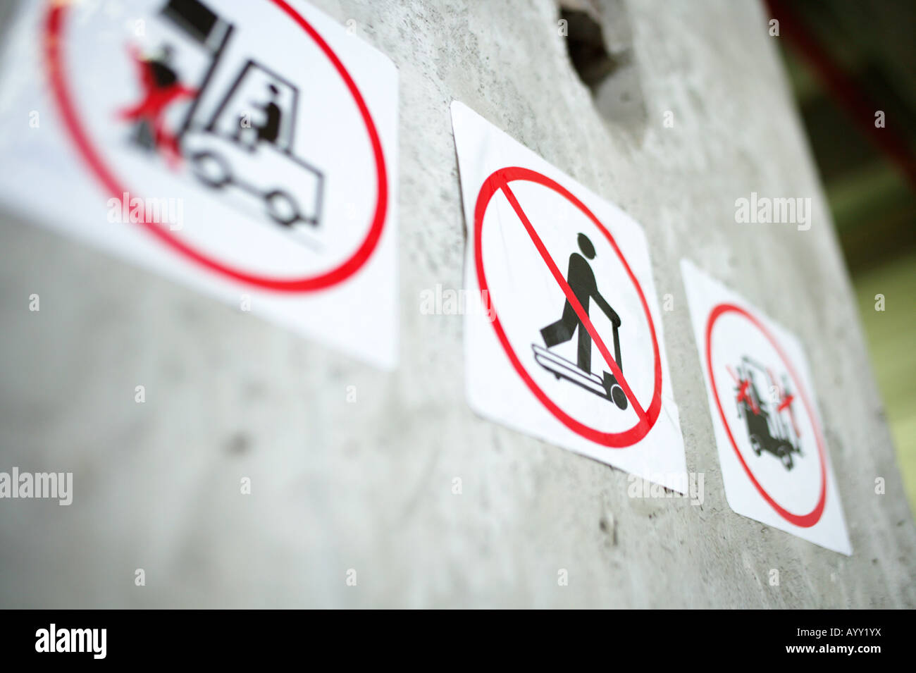 Prohibition signs on a concrete wall Stock Photo - Alamy