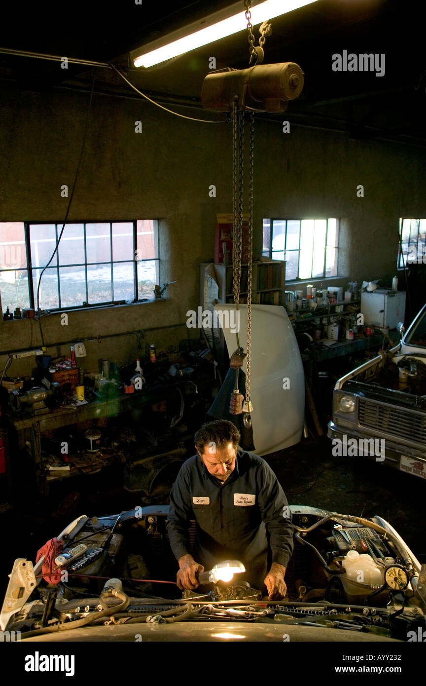 Hispanic mechanic working in auto hi-res stock photography and images ...