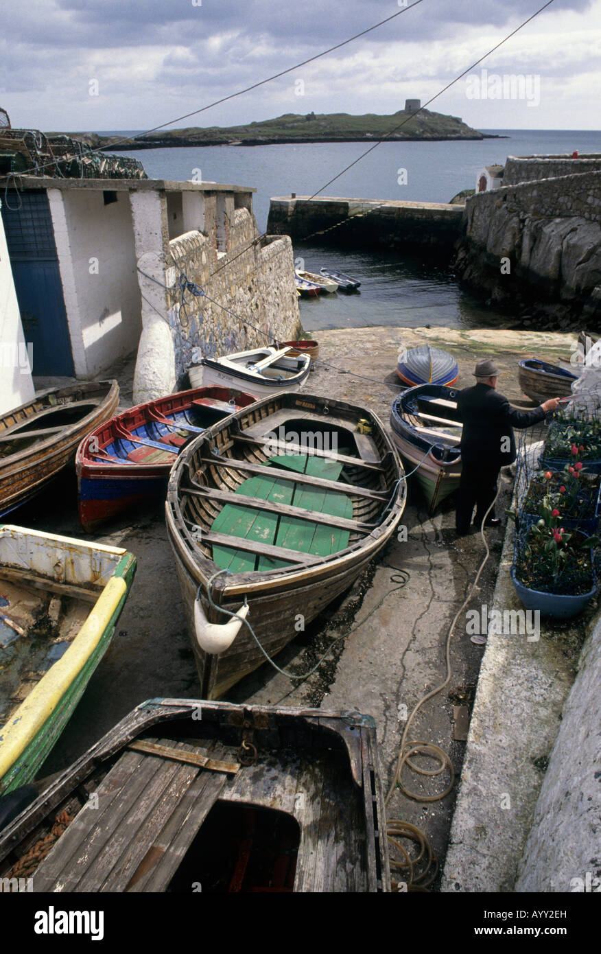 Wooden boats on the slip in Coliemore Harbour, with Dalkey Island and ...