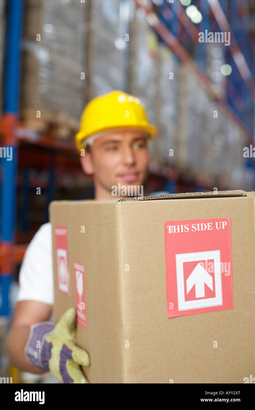 Man carrying a packet Stock Photo - Alamy