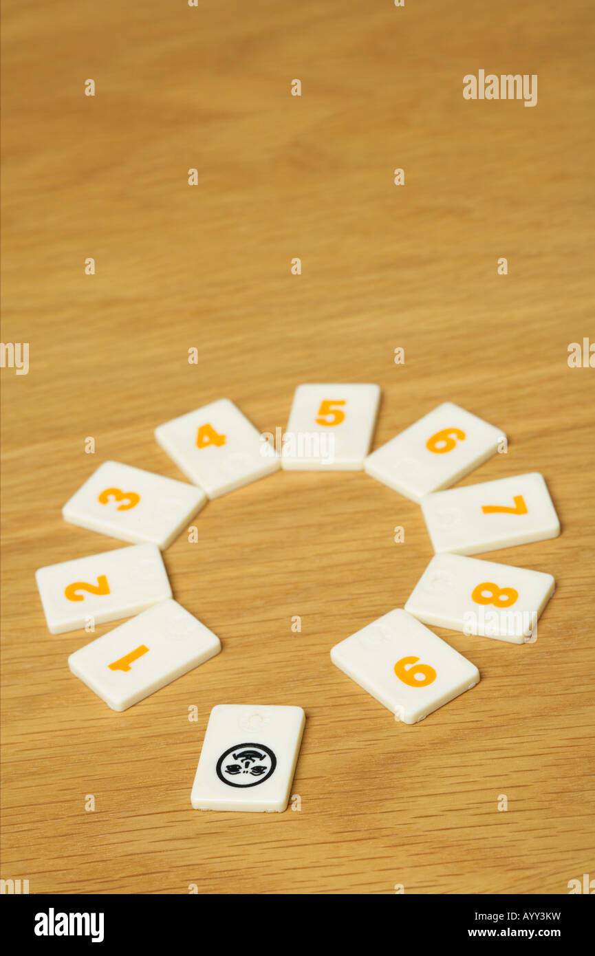 A tile with a smiley and tiles with numbers forming a circle Stock ...