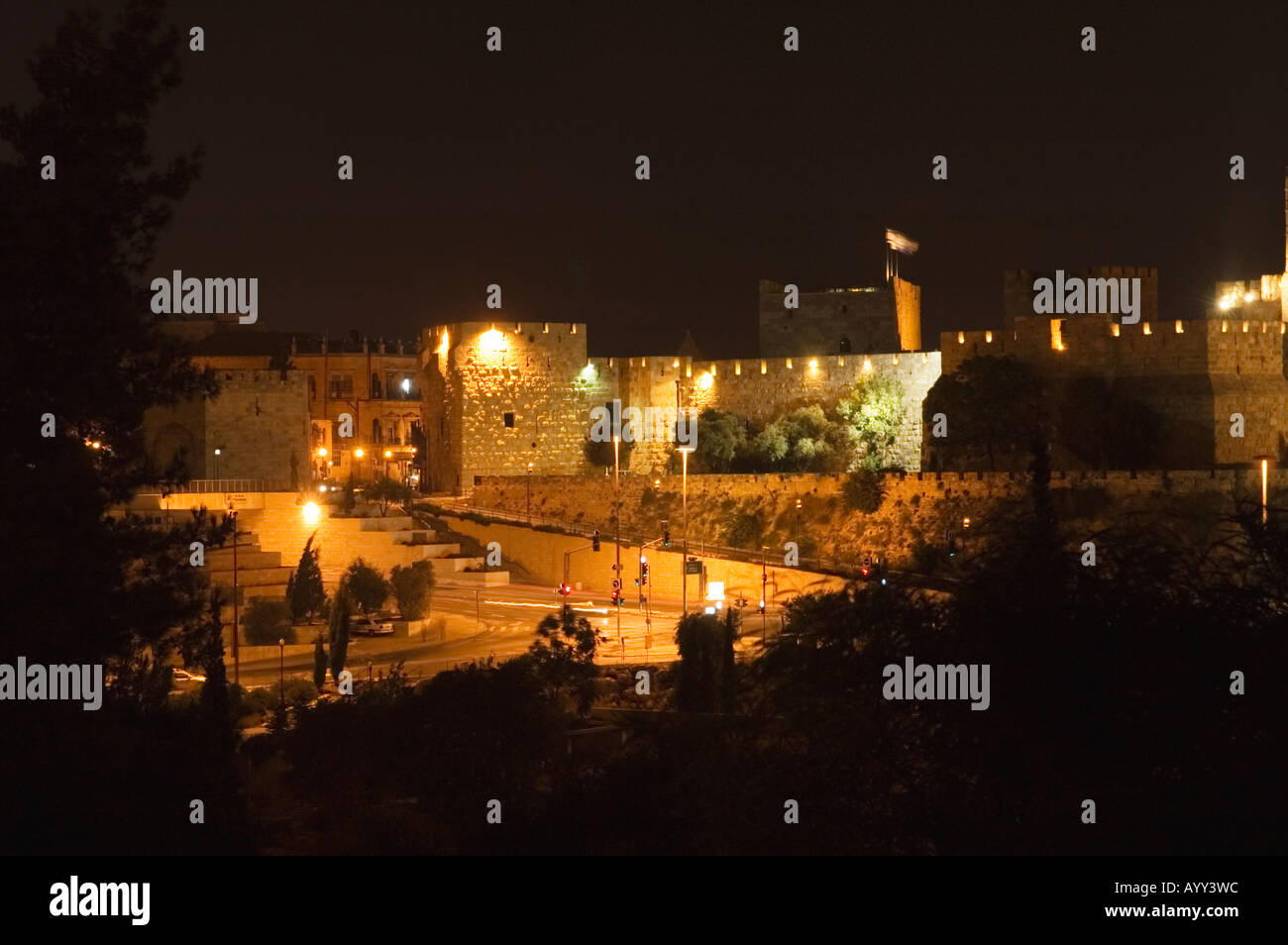 Jaffa gate of the walled city in Jerusalem at night with flags flying ...