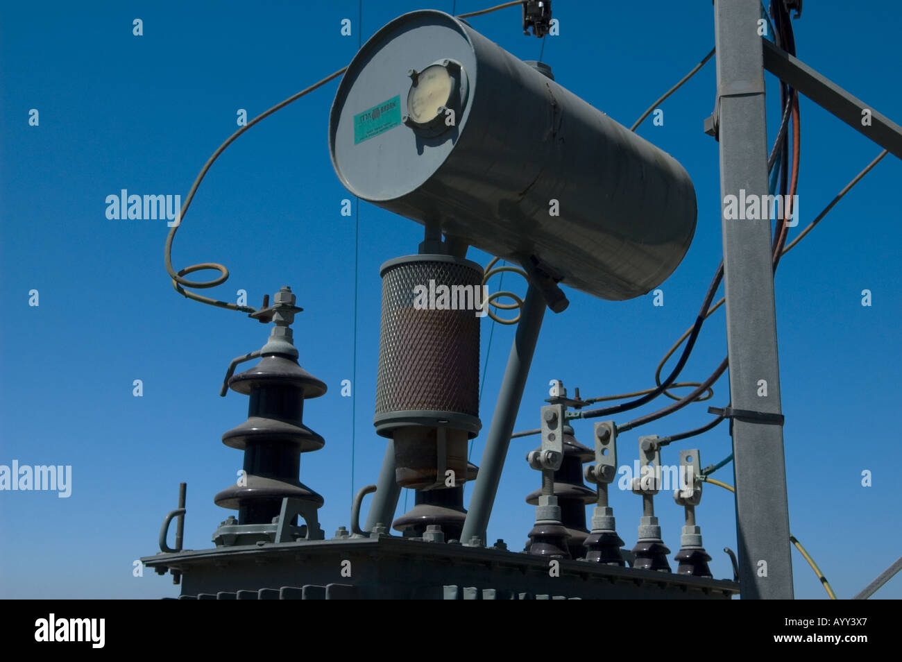 Middle east Electrical grid Transformer on pylon against blue sky Stock ...