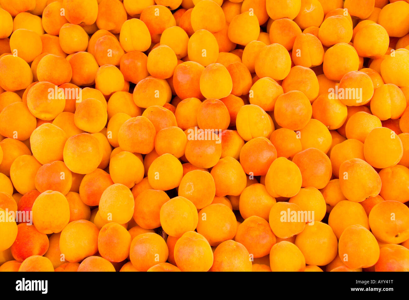 A closeup of apricots at a colorful fruit market on Tsimiski Street in ...