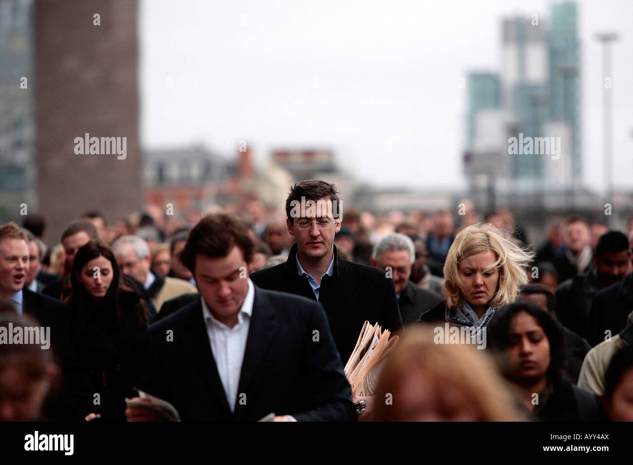 Commuters walk over London Bridge towards the City of London Stock ...