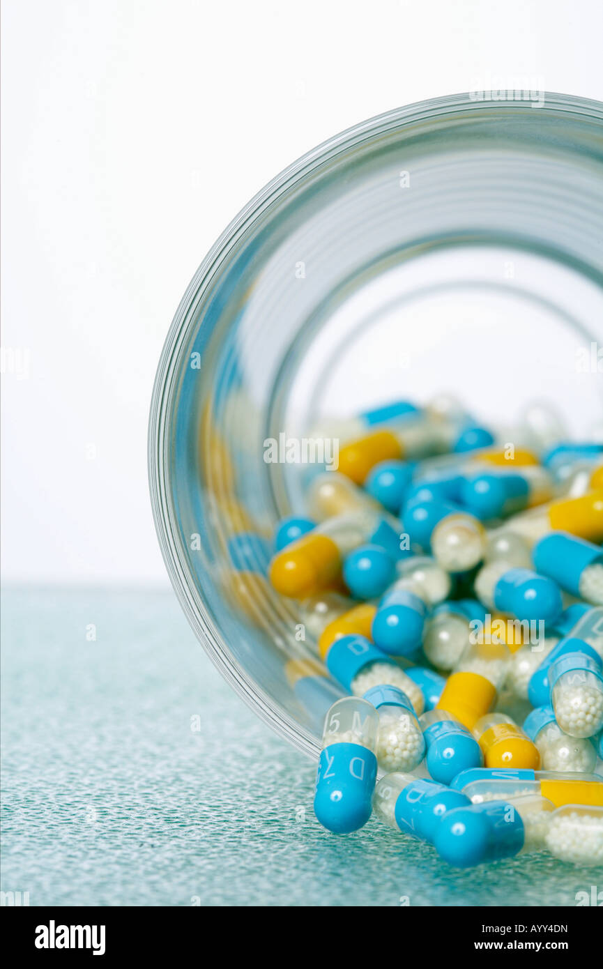 Capsules in a glass Stock Photo - Alamy
