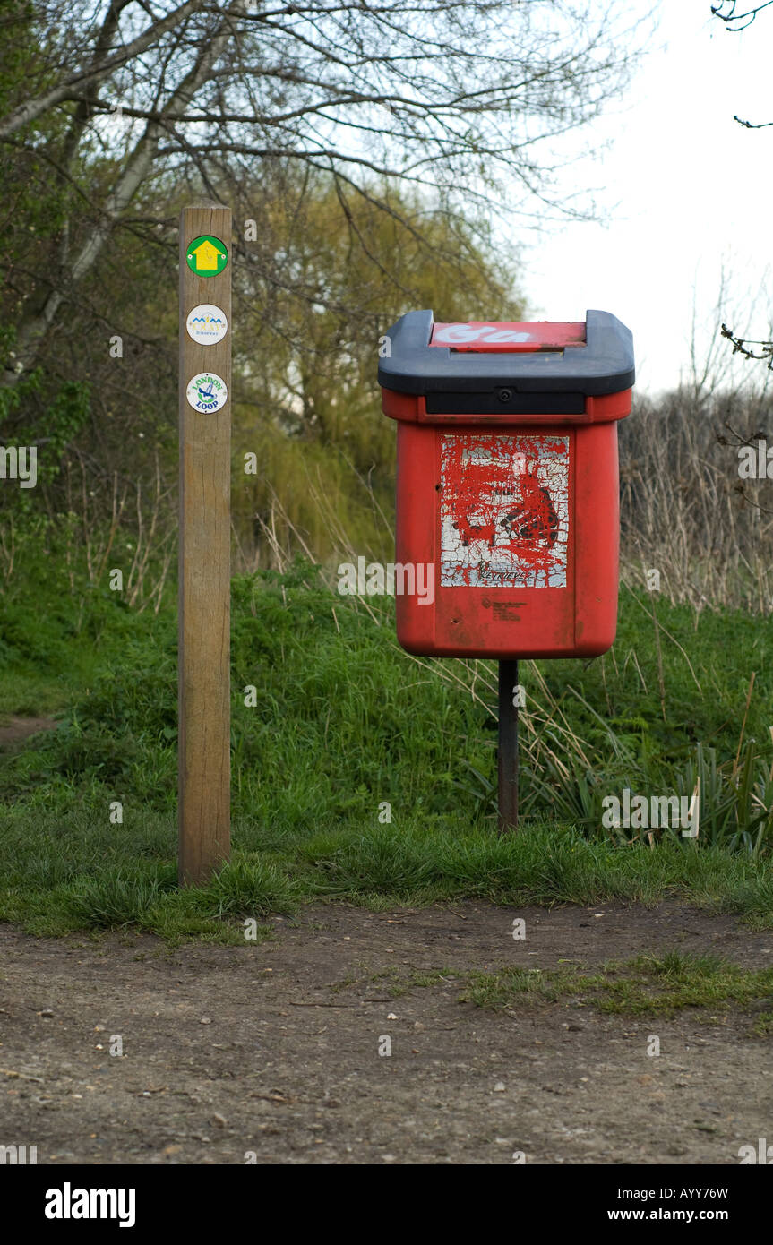 Footpath sign next to waste bin for dog mess Stock Photo - Alamy