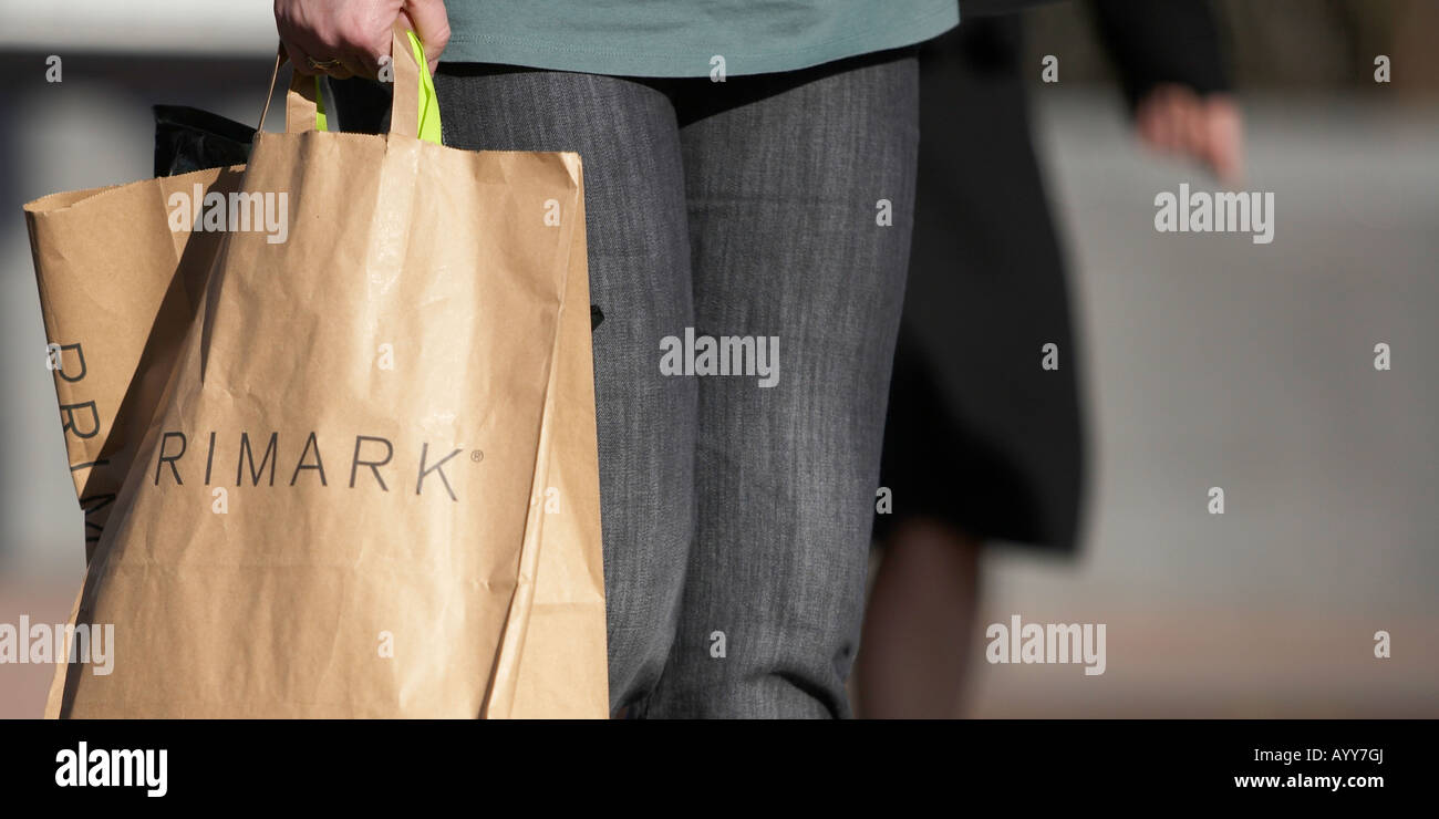 Lady carrying a Primark shopping bag in Leeds, West Yorkshire Stock ...