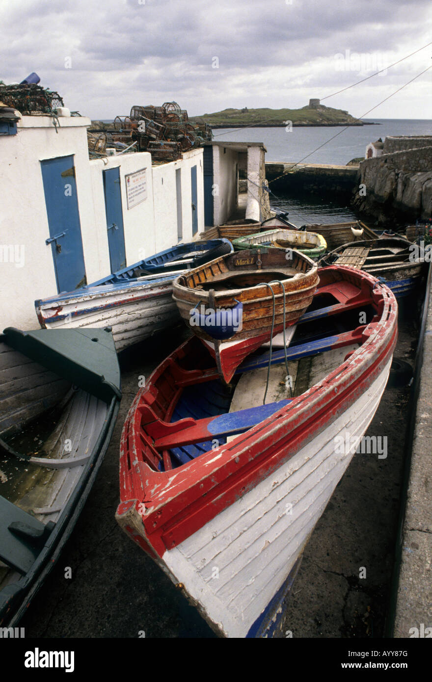 Wooden boats on the slip in Coliemore Harbour, with Dalkey Island and ...