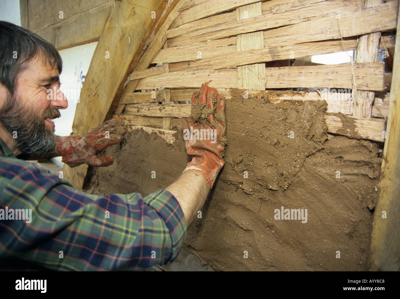 Mike Abbott building with Wattle and Daub walls with a green wood ...