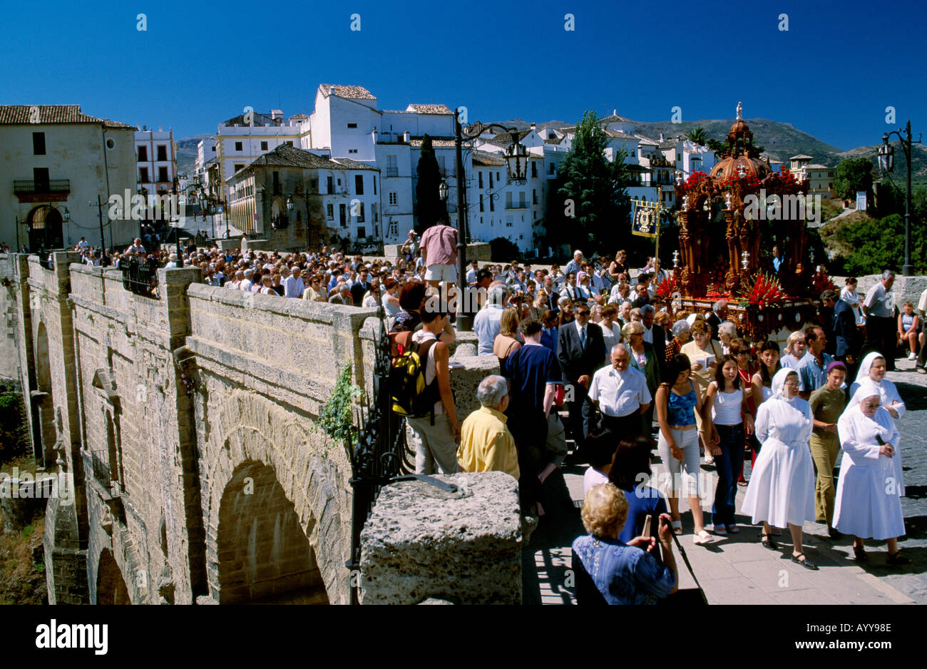 Nuns lead the bystanders following the Catholic Easter Parade through ...
