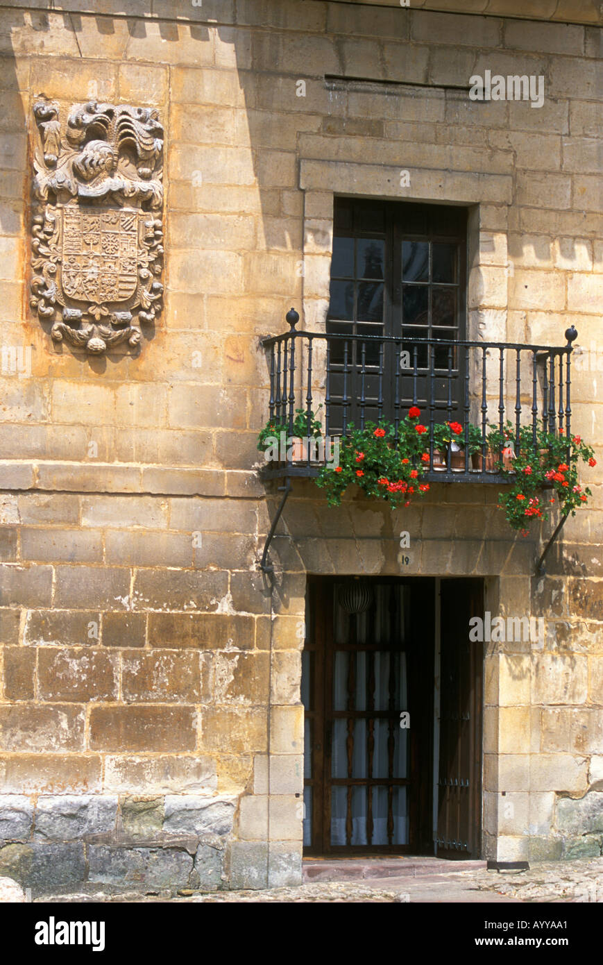 Balcony decked with geraniums and armorial shields Santillana del Mar ...