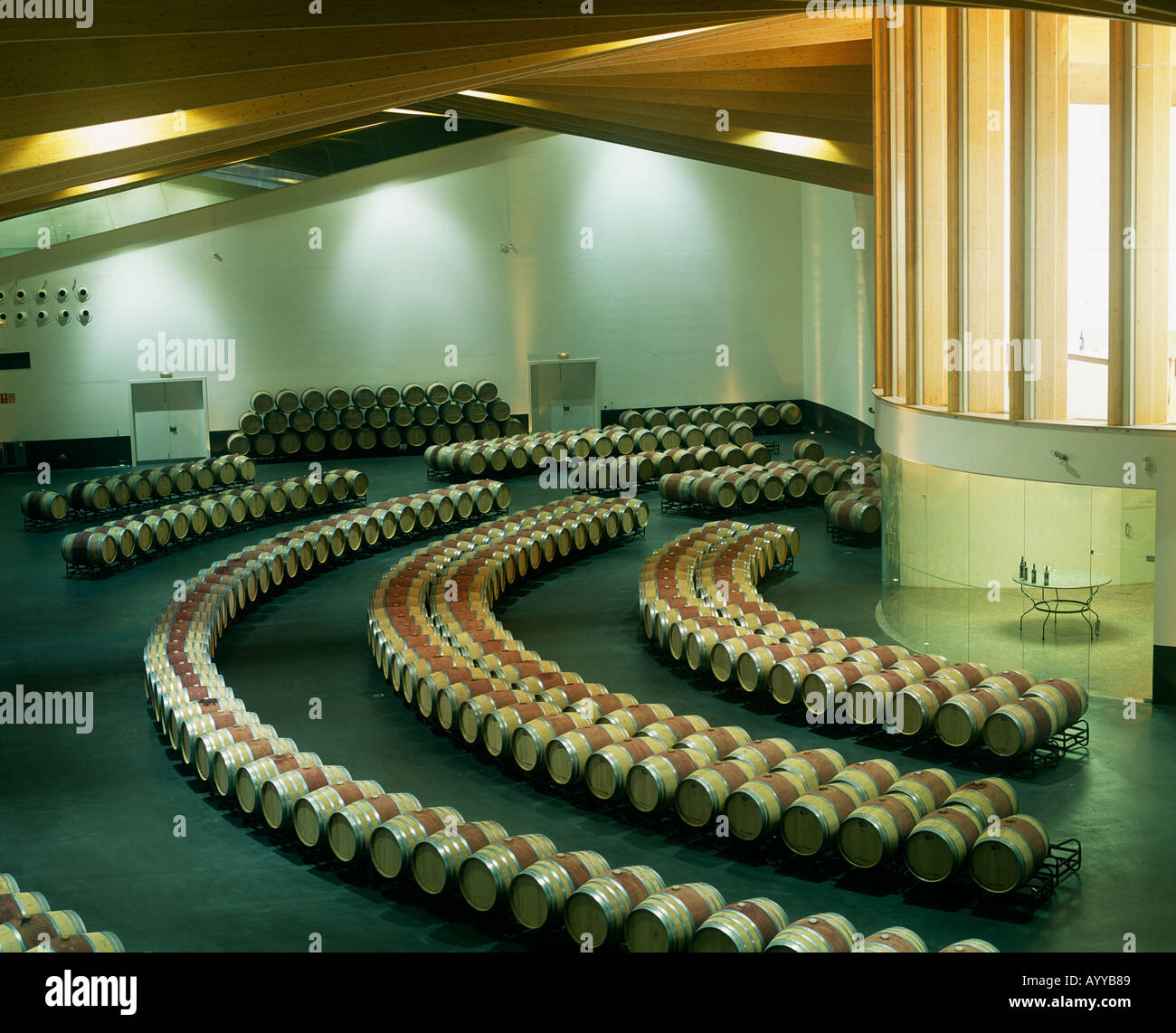 Wine barrels are laid out in artistic curves at Ysios winery Stock ...