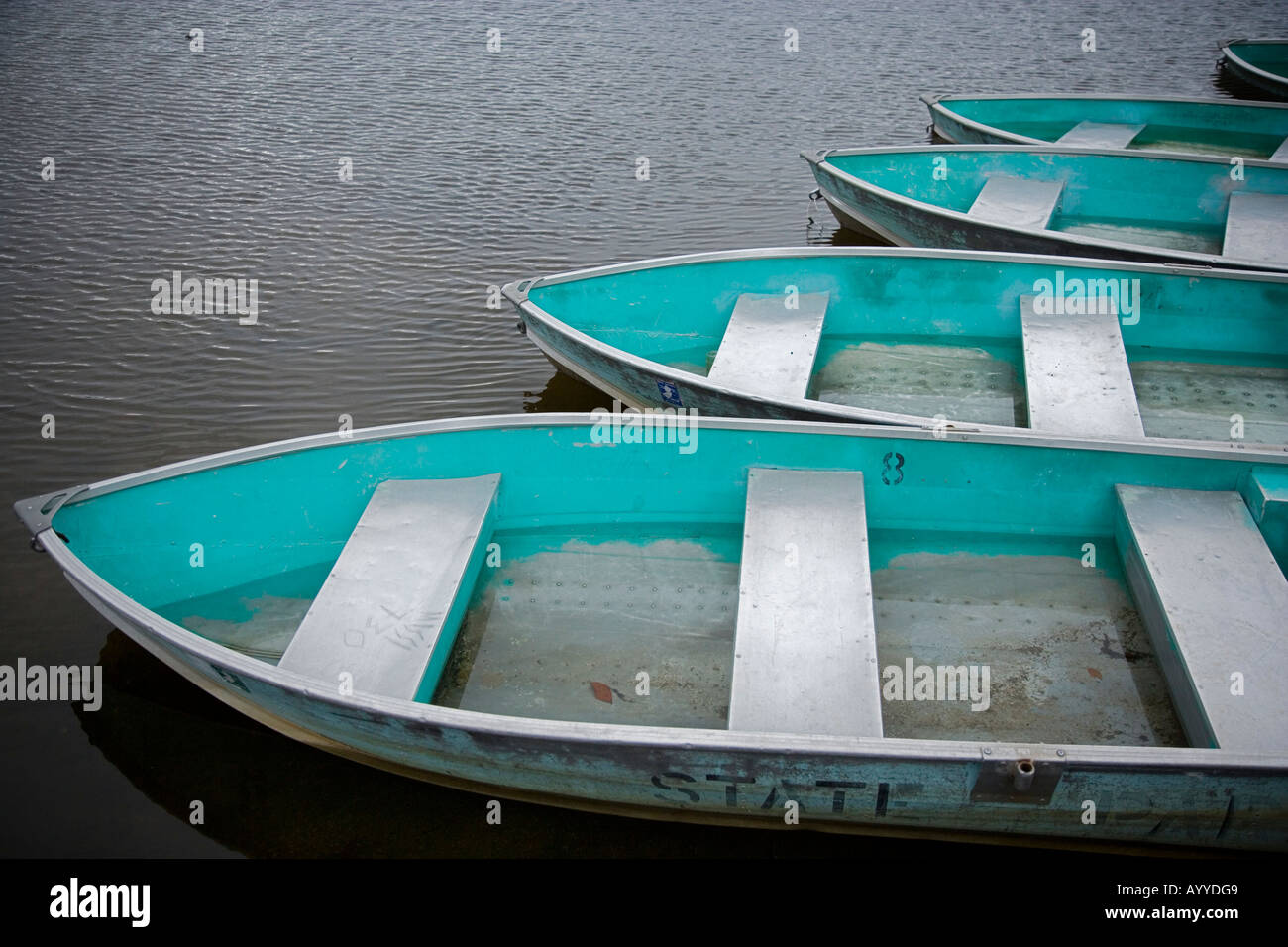 Rowboats docked by a lake Stock Photo - Alamy