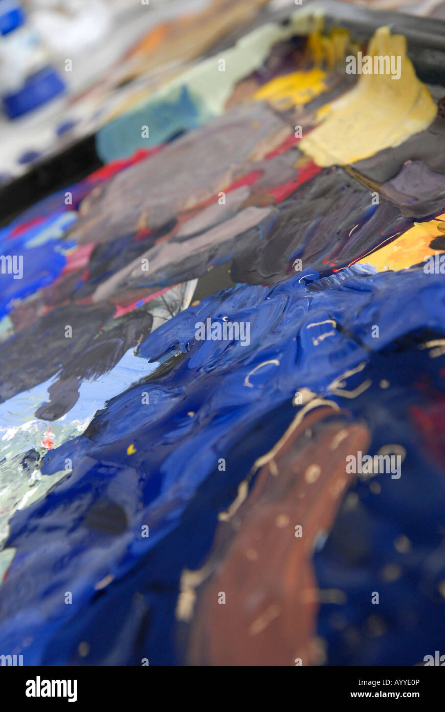 Mixed paints on an artists' palette Stock Photo - Alamy