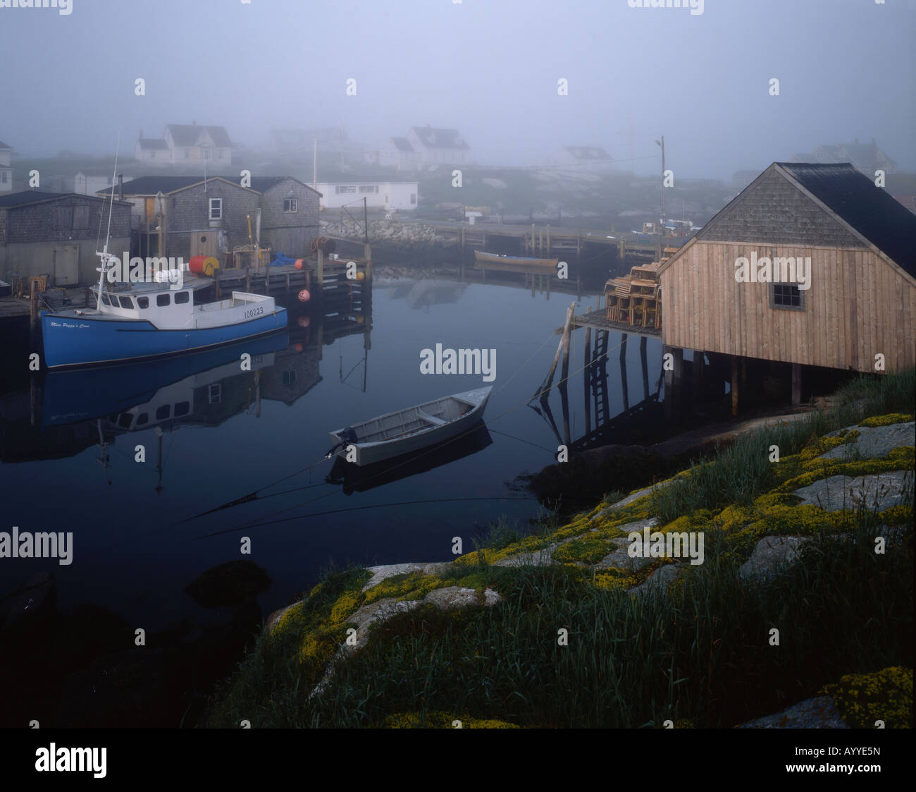 Misty Cove with Boats Stock Photo - Alamy