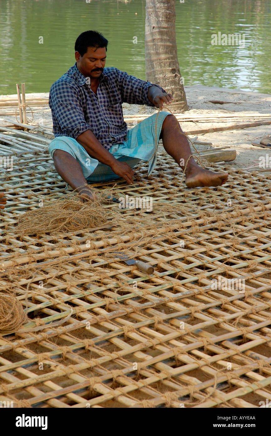 Houseboat building using coir ropes and bamboo Kerala South India Stock ...