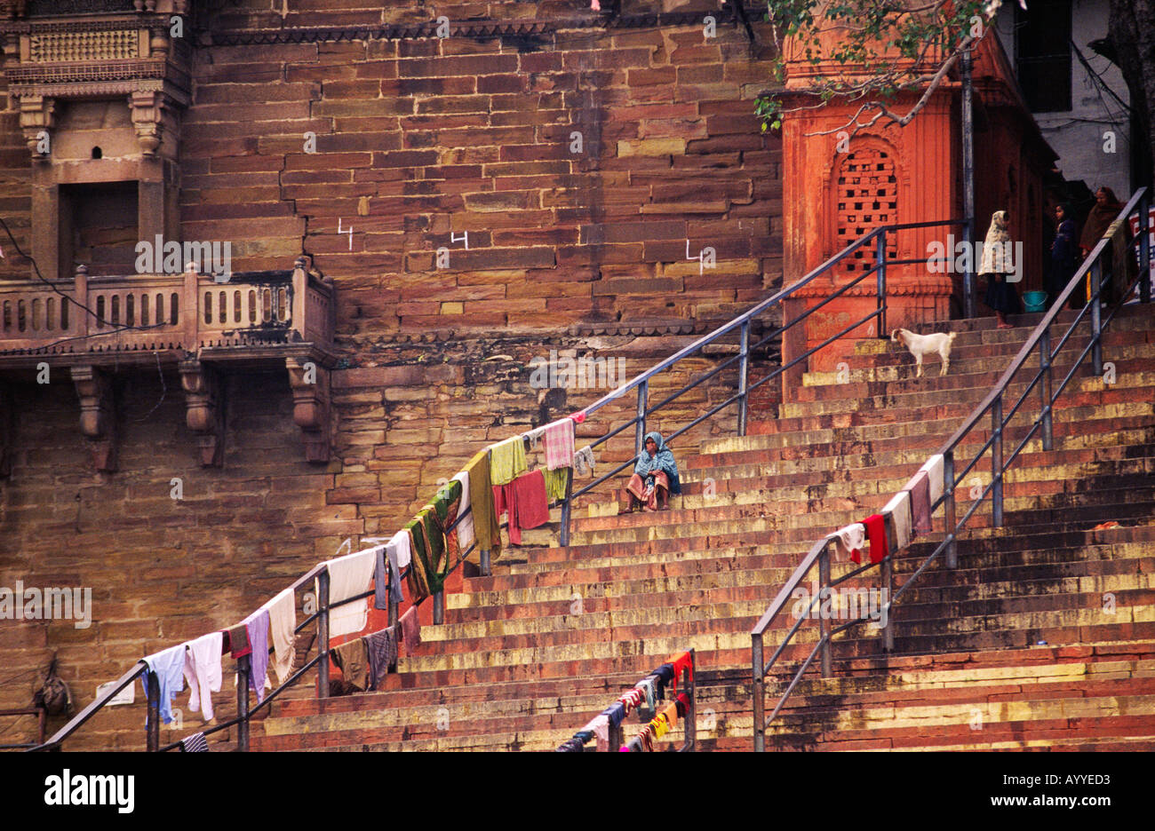 Many steep stairs with clothes drying on steps on of the Ghat in ...