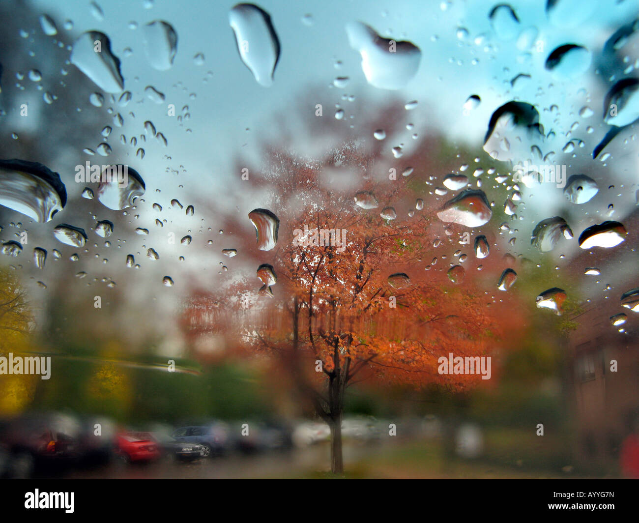 Parking lot seen through wet car window Stock Photo - Alamy