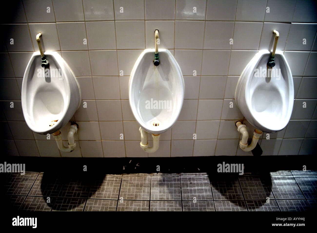 Urinals in restaurant cloakroom Stock Photo - Alamy
