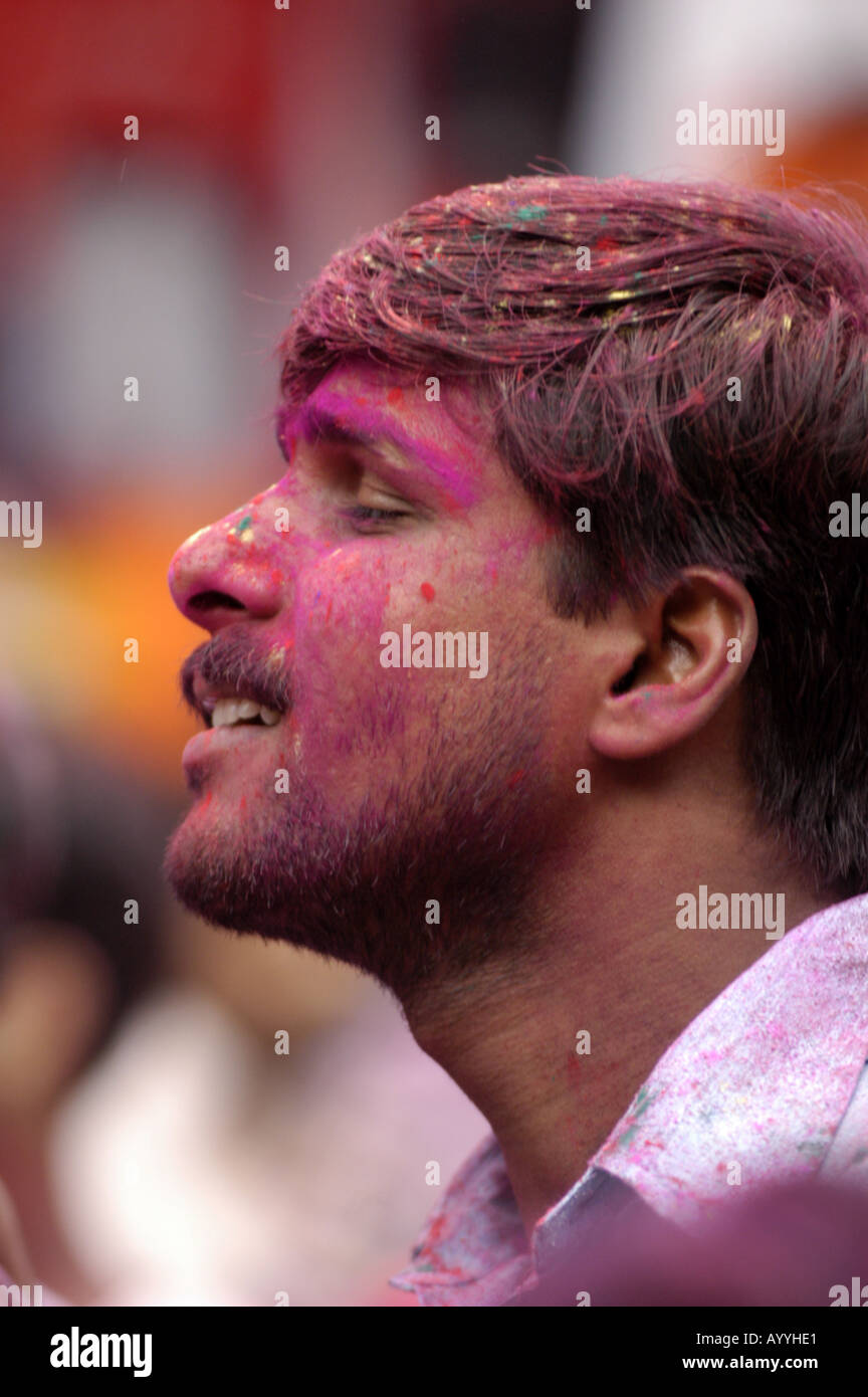 Close up of face of Indian man dancing on the street of New Delhi ...