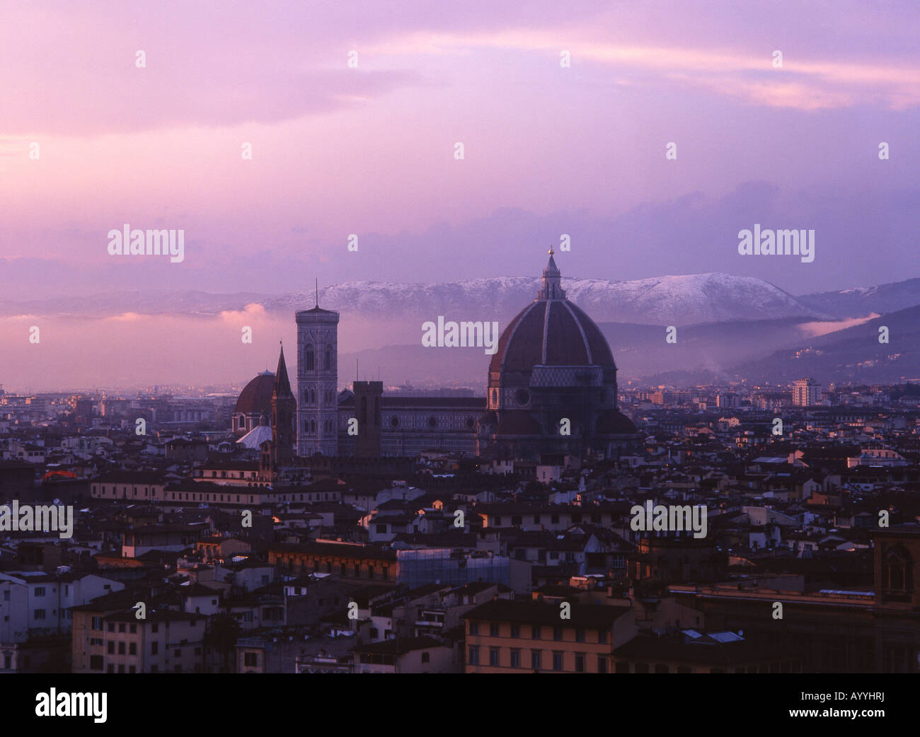 Sunset view of Duomo with snow on mountains behind Florence Firenze ...