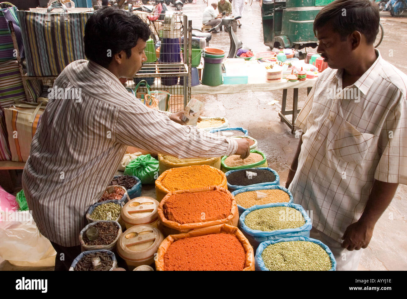 A street marchant selling Indian spicies to local customer Paharganj ...