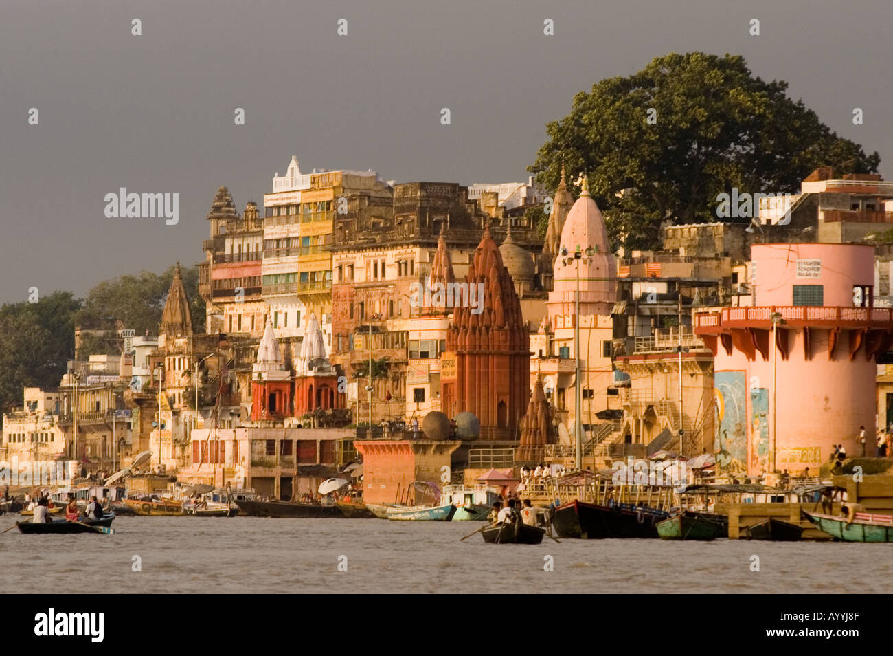 Varanasi Ghats and Hindu temples at sunrise on the bank of Ganges river ...