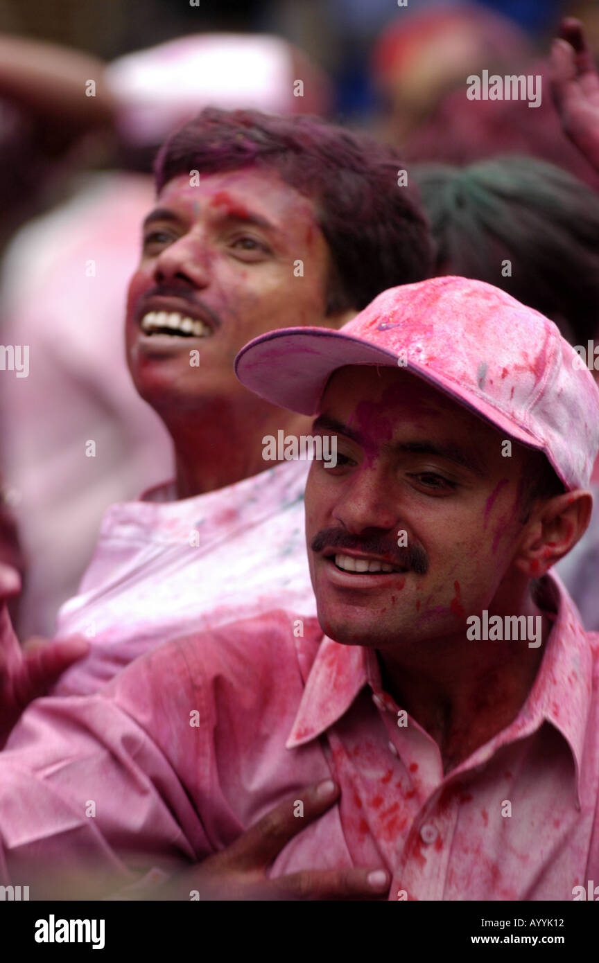 Group of Indian man dancing on the street of New Delhi during Holi ...