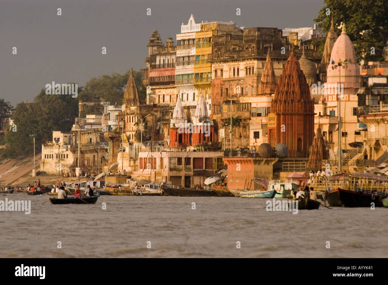 Varanasi Ghats and Hindu temples at sunrise on the bank of Ganges river ...
