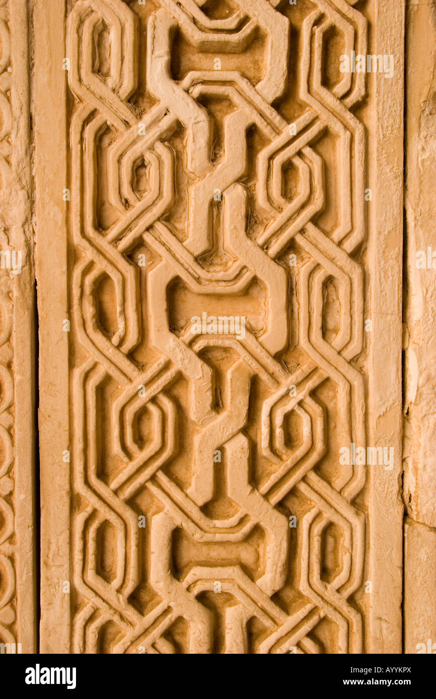 Decorative and ornate carved stucco walls at the Alhambra Palace in ...
