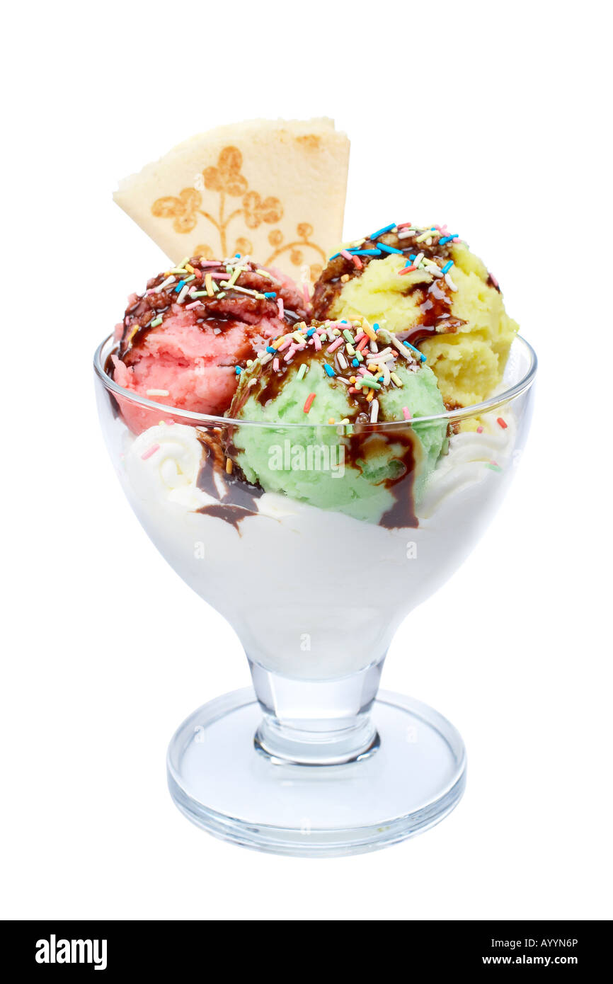 Delicious multi flavor ice cream with chocolate syrup in glass bowl ...