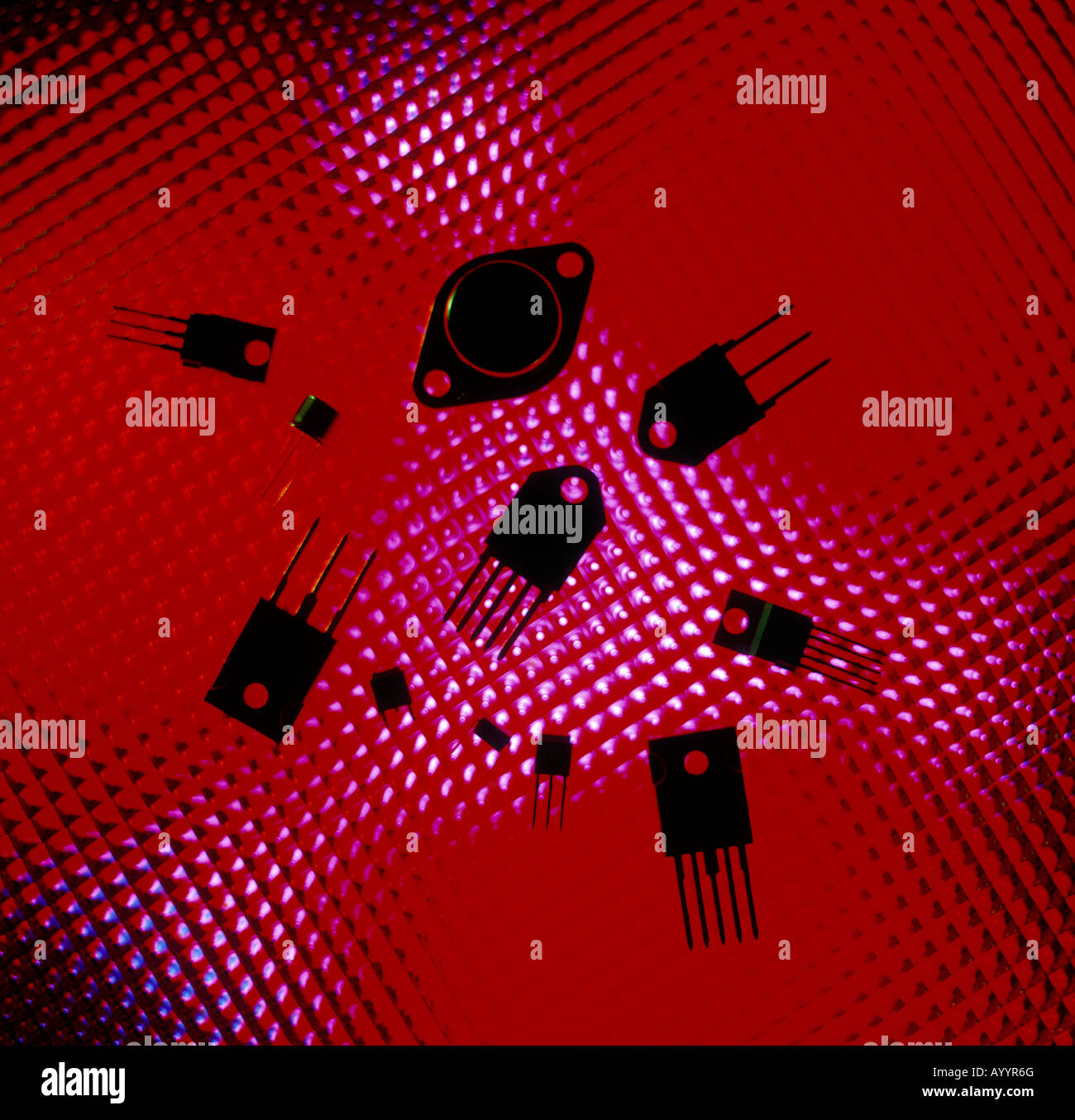CMOS electronic components in silhouette form above glowing red orbs ...