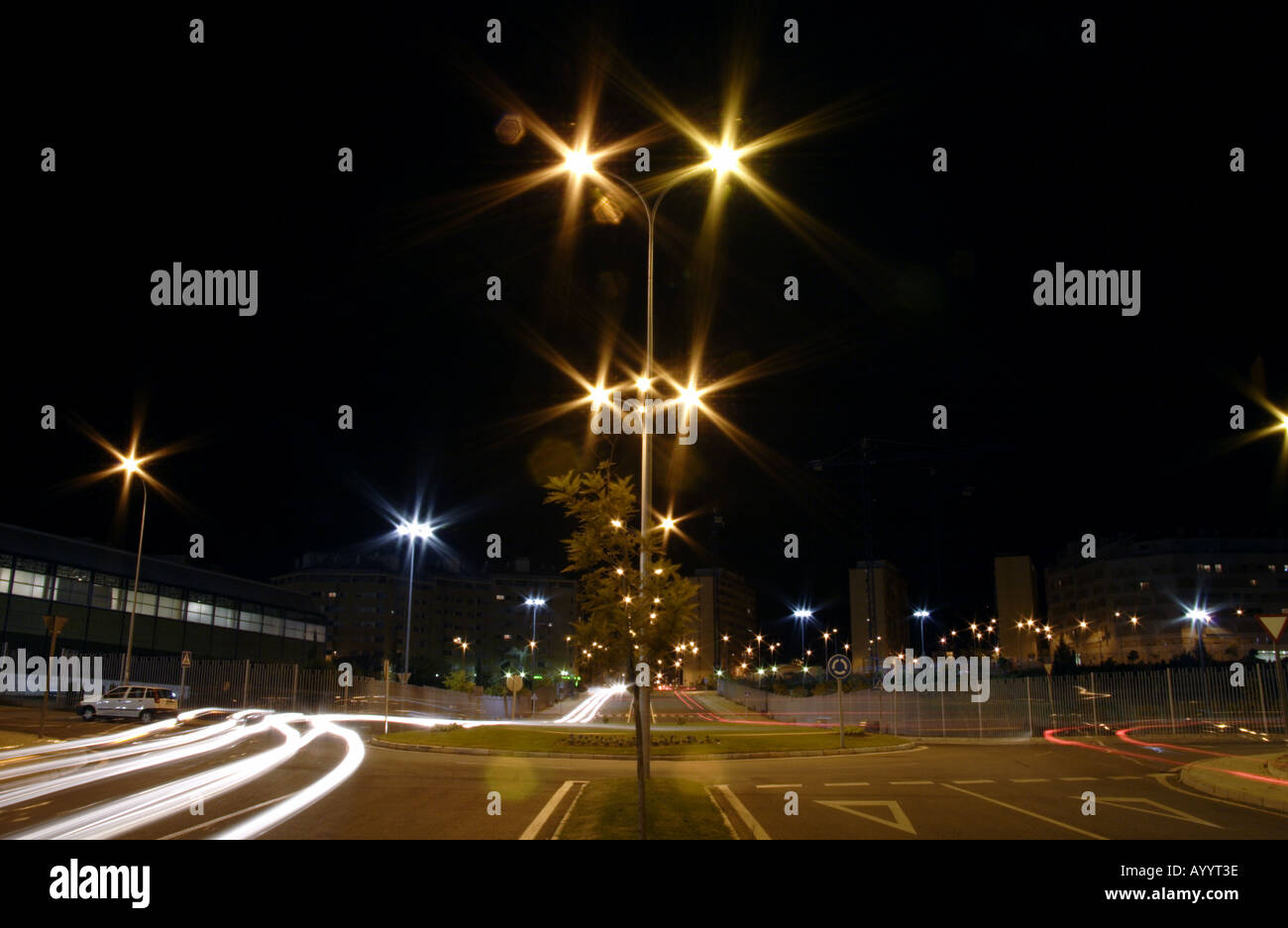 Cars driving around a roundabout at night in Spain Stock Photo - Alamy