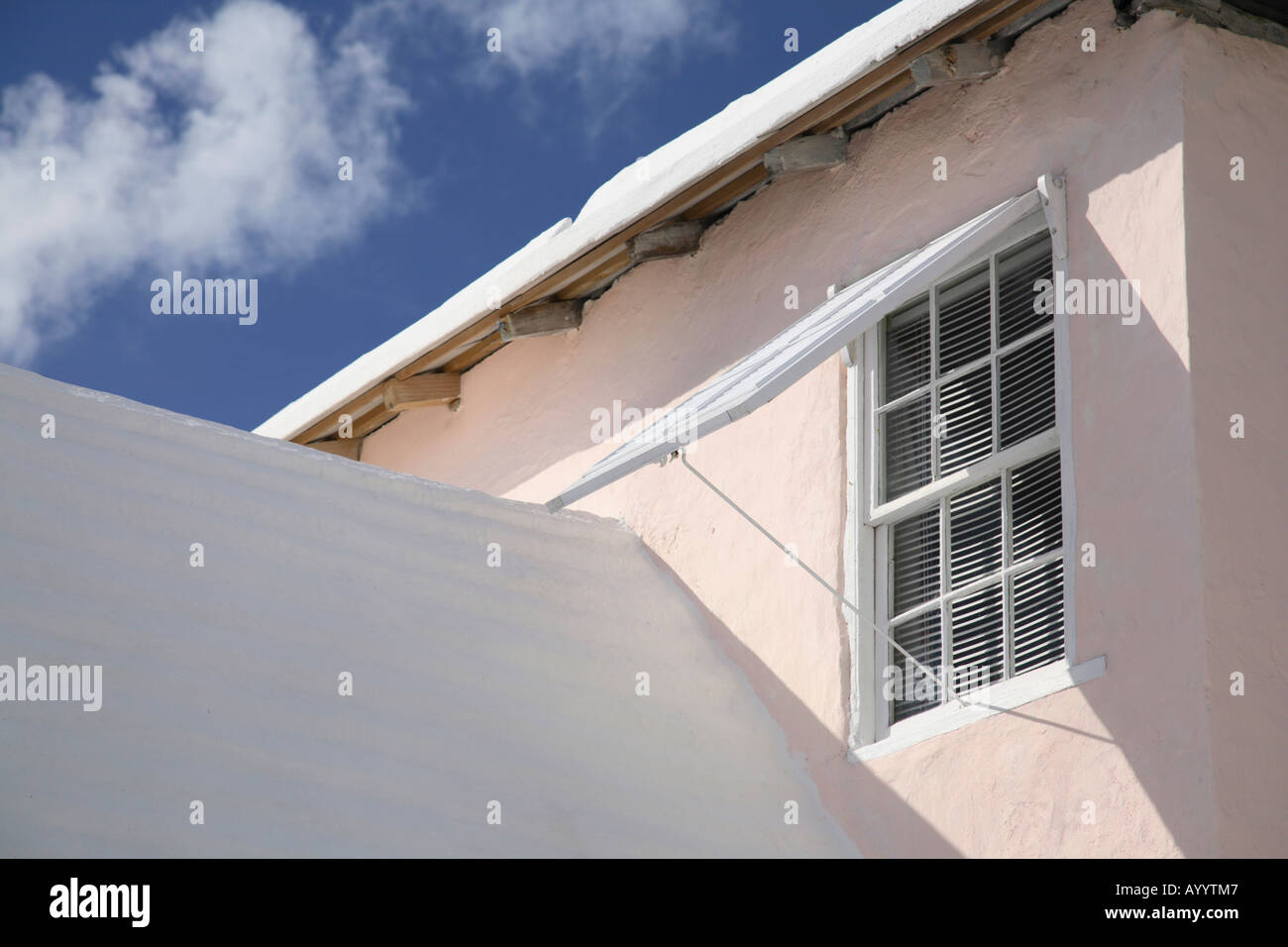 Louvred shutter shading the window of a house in St George, Bermuda ...