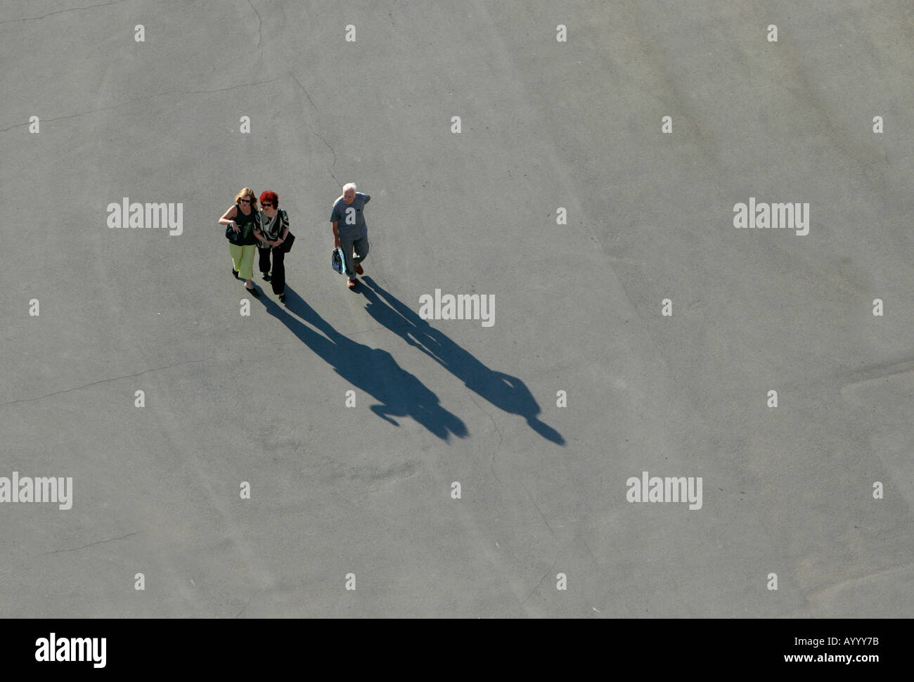 People walking shadows high angle view pedestrian passerby stone paving ...