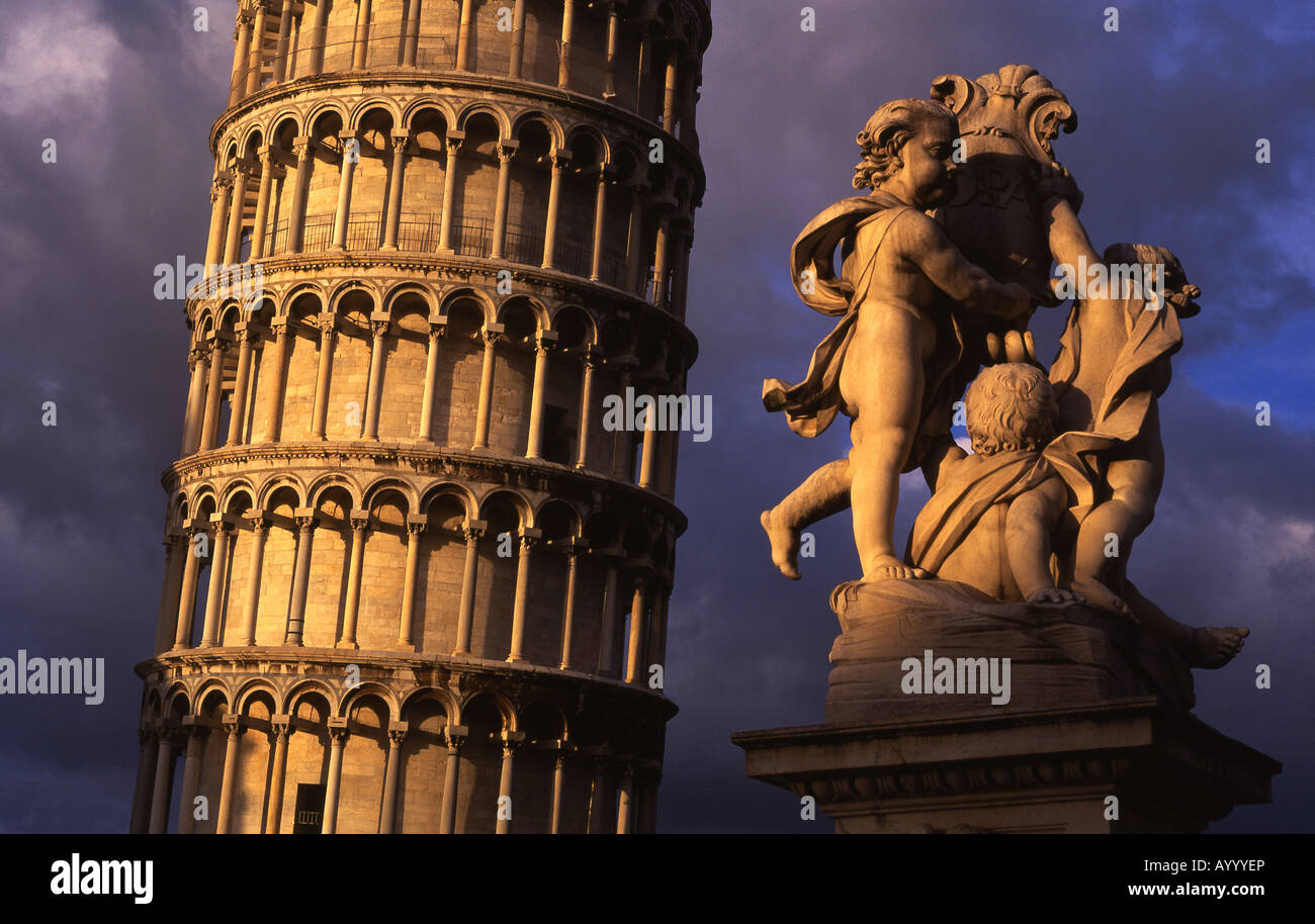 Cupid statue and Leaning Tower of Pisa at sunset Piazza del Duomo Campo ...