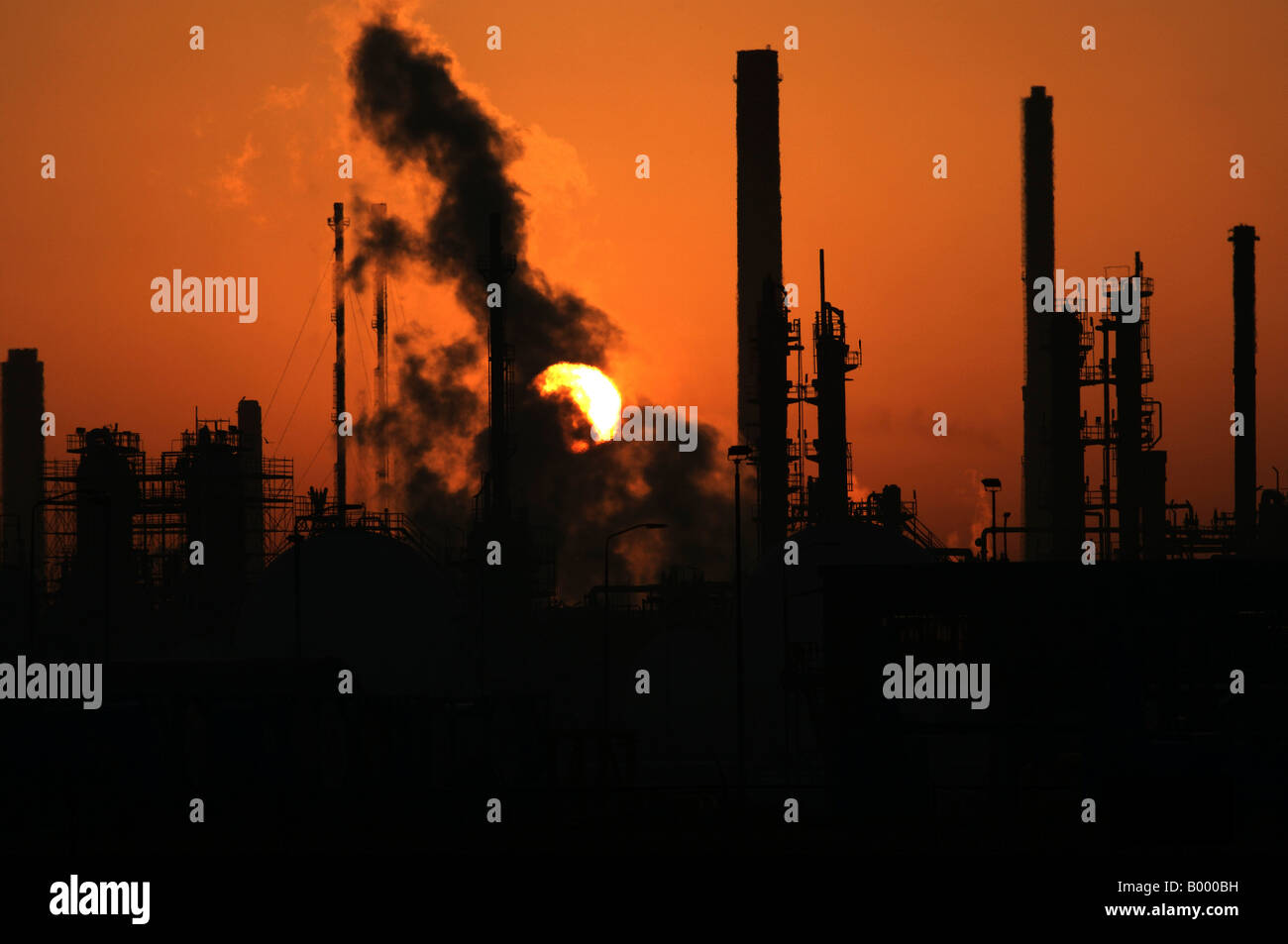Port of Rotterdam refinery of Esso at sunrise Stock Photo - Alamy
