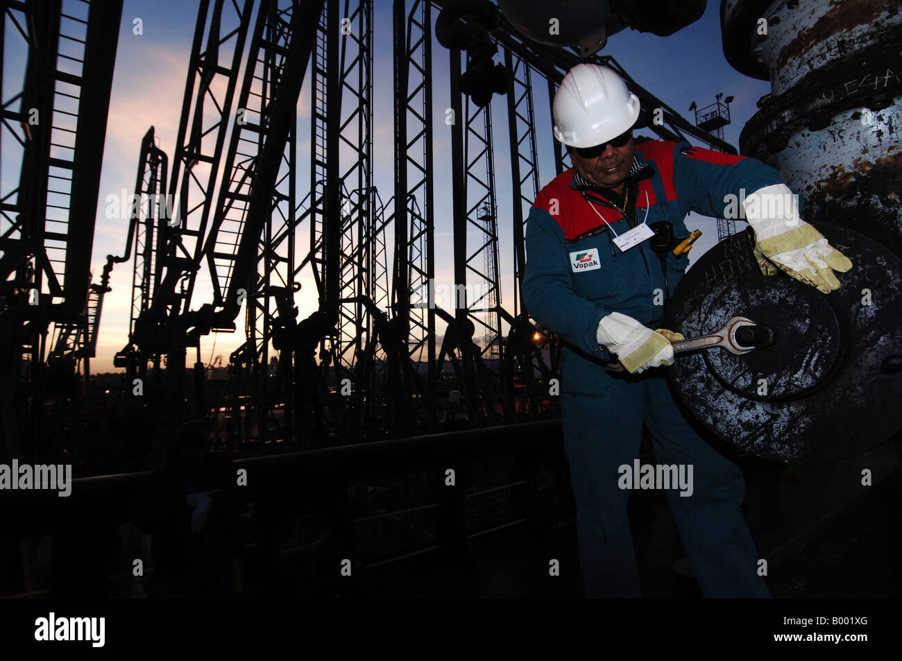 Port of Rotterdam Botlek Vopak Oil Terminal a worker connecting the ...