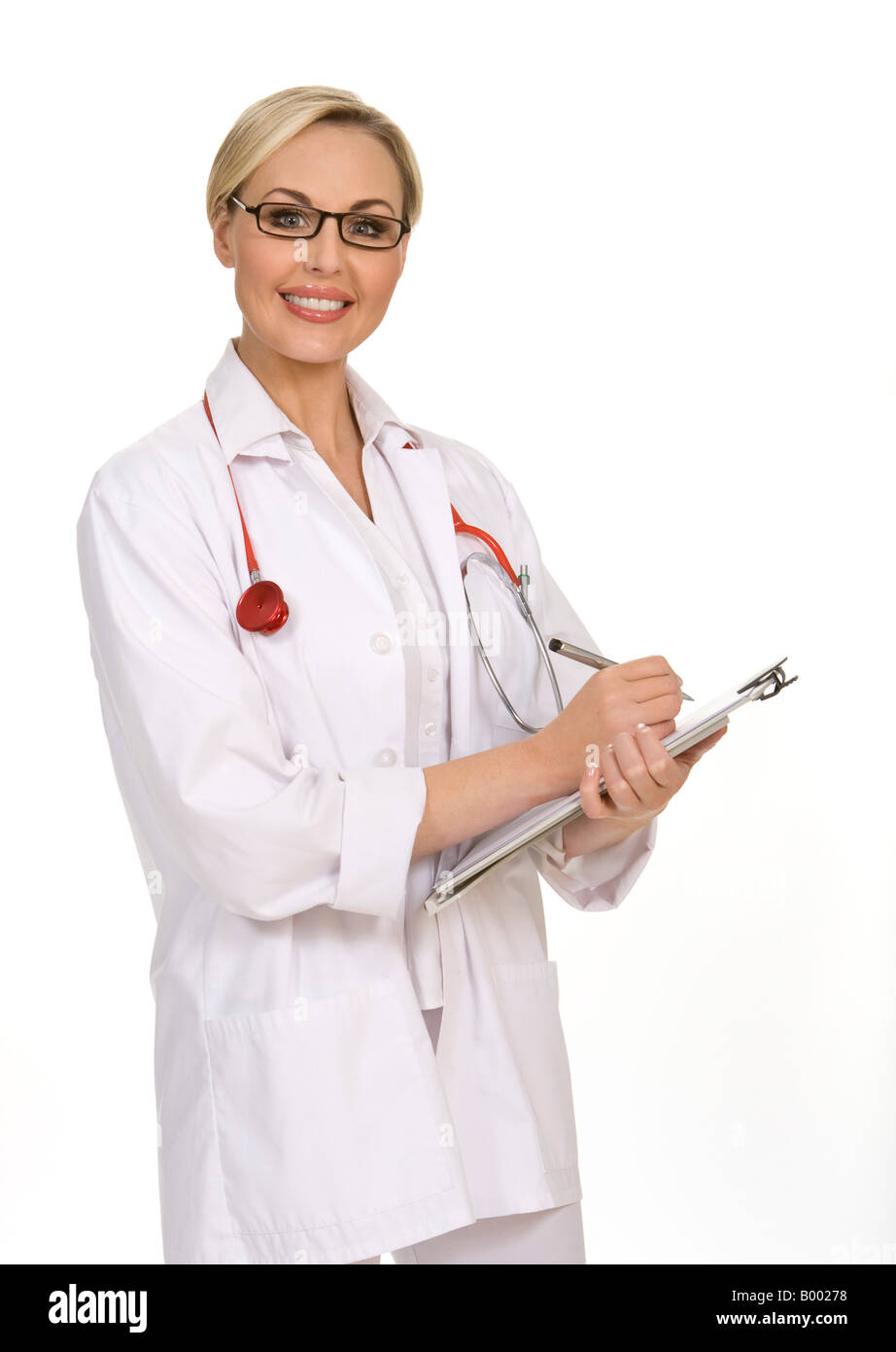 Attractive female doctor writting on medical chart isolated on a white ...