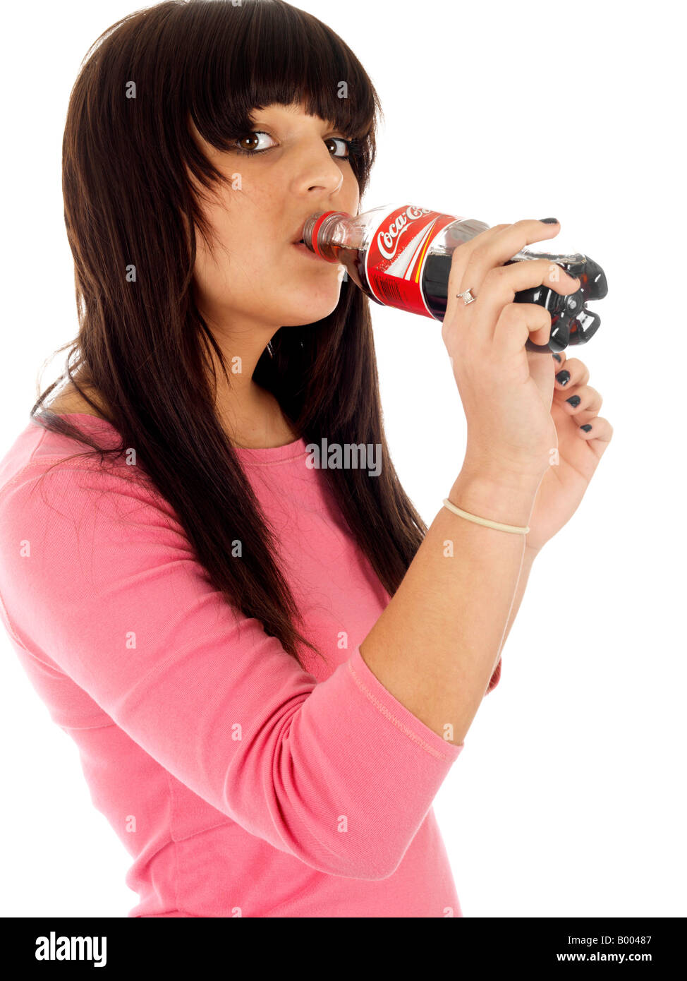 Woman drinking coca cola bottle hi-res stock photography and images - Alamy