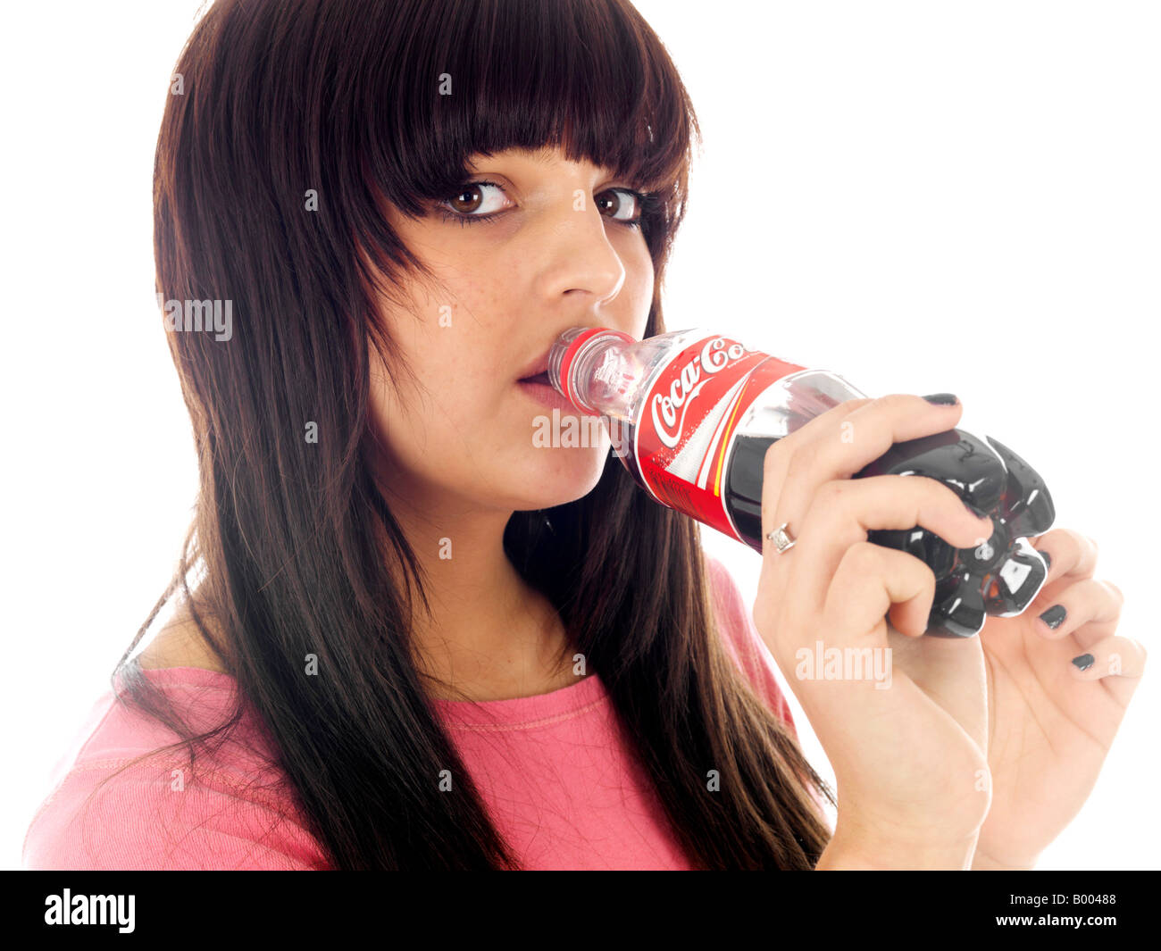 Teenager Drinking Bottle of Coke Model Released Stock Photo - Alamy