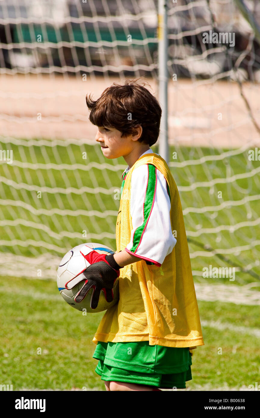 9 Year old boy at the Goalie position for soccer with ballll Stock ...