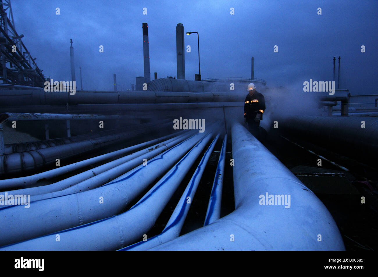 Port of Rotterdam refinery of Esso worker checking the cooling system ...