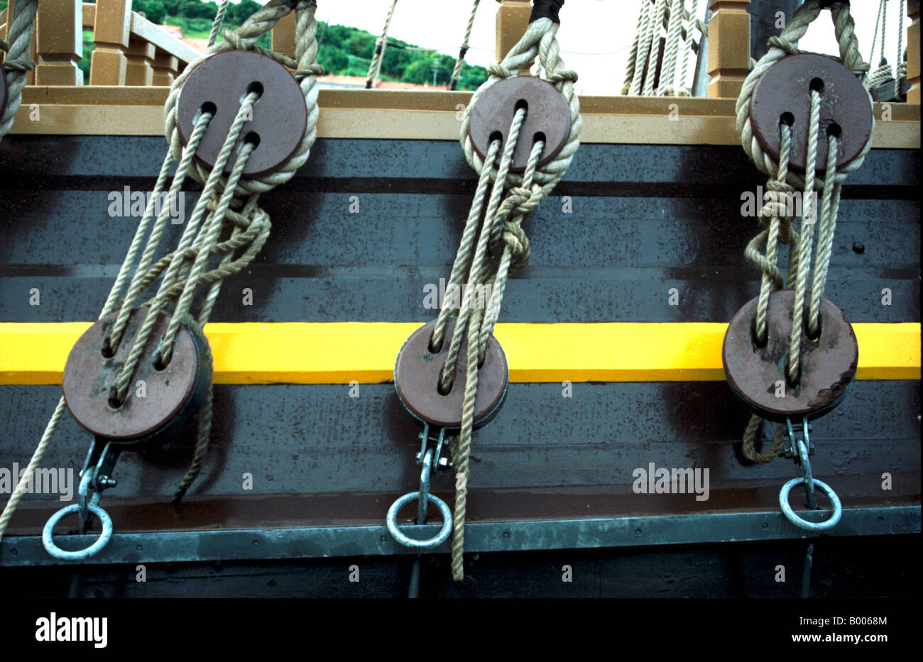 Pulleys on side of old sailing ship Stock Photo - Alamy