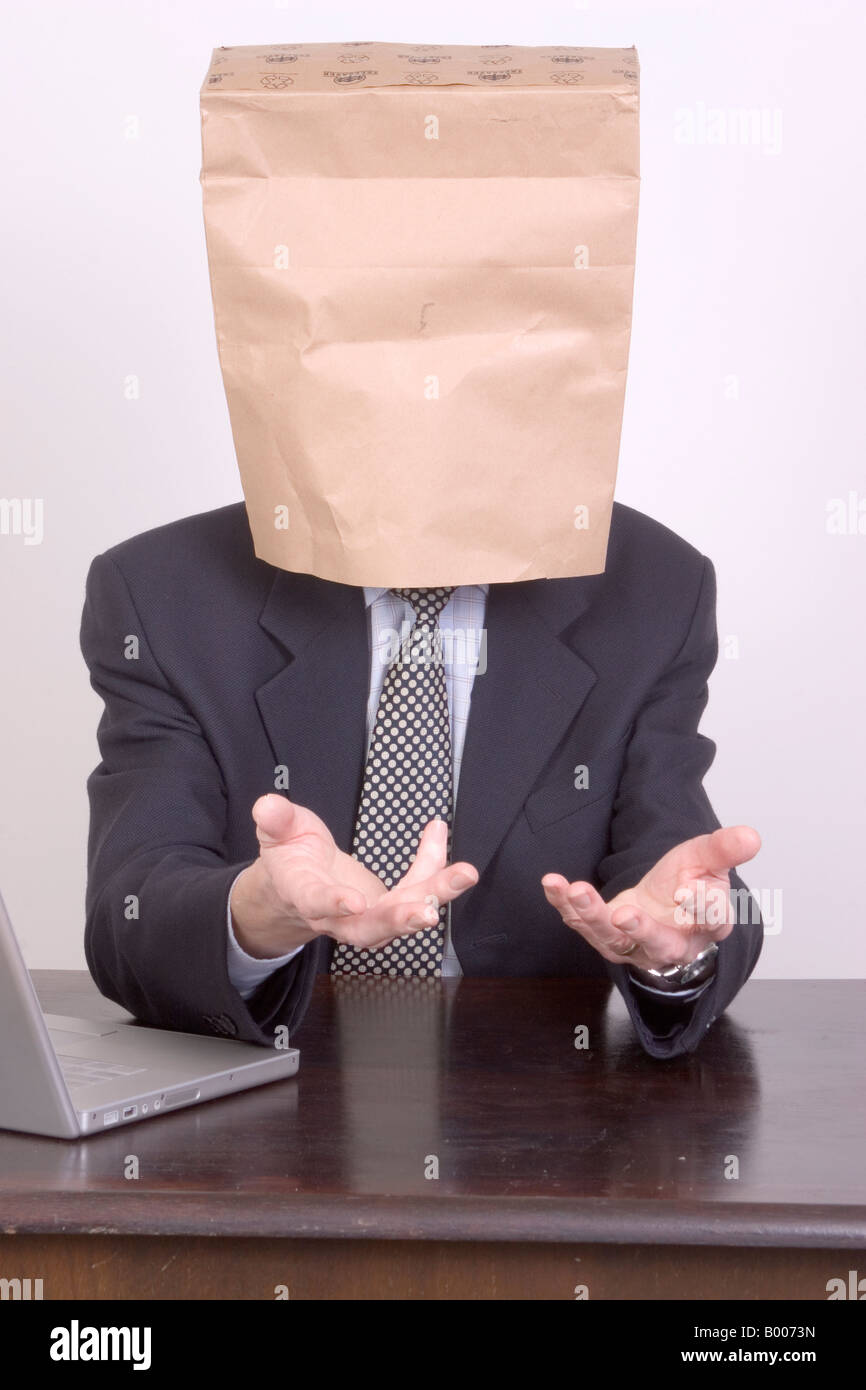 The faceless office worker in bureaucracy behind the desk Stock Photo ...