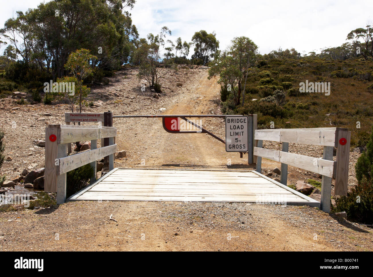 A closed gate leading to a track in the Tasmania high country during ...
