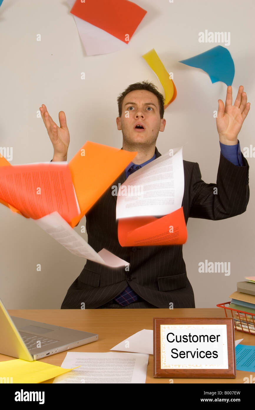 Overworked in customer services department Stock Photo - Alamy