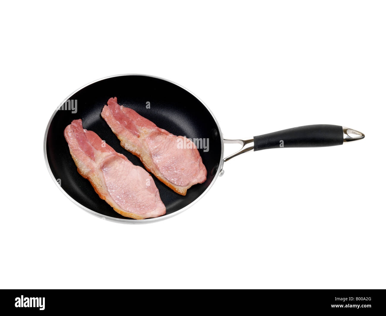 Cooking Bacon Rashers In A Frying Pan Isolated Against A White ...