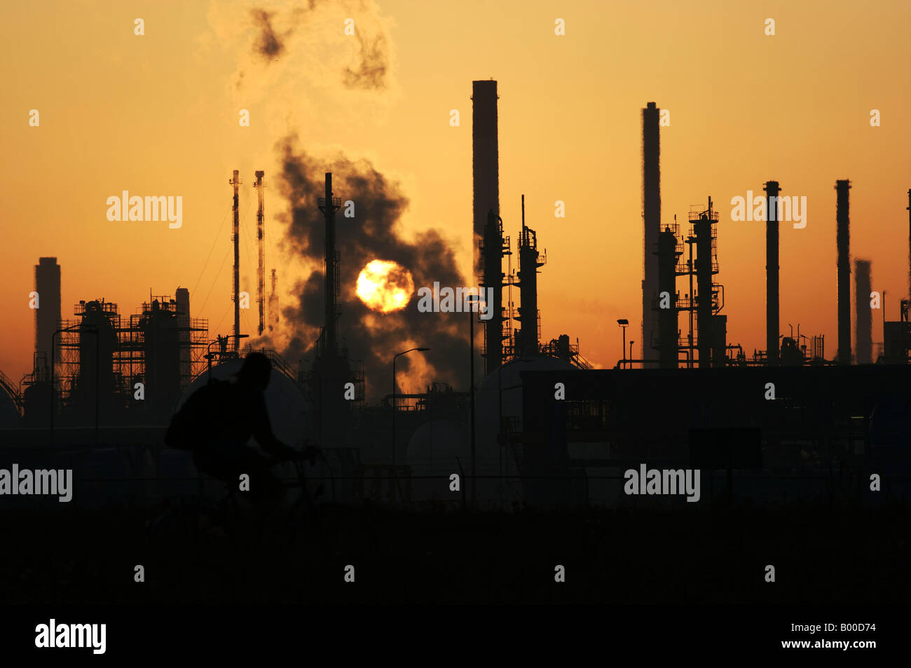 Port of Rotterdam refinery of Esso at sunrise Stock Photo - Alamy